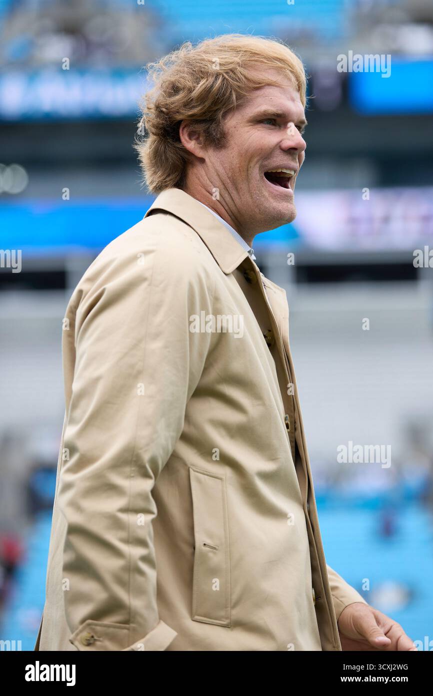 Fox NFL color commentator Greg Olsen smiles as he walks off the field ...
