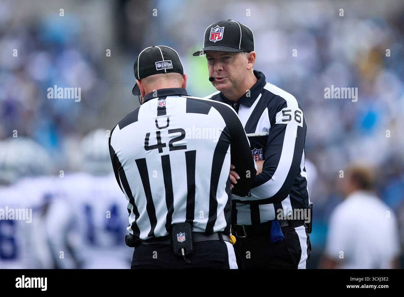 Side judge Allen Baynes (56) chats with umpire Duane Heydt (42) during ...