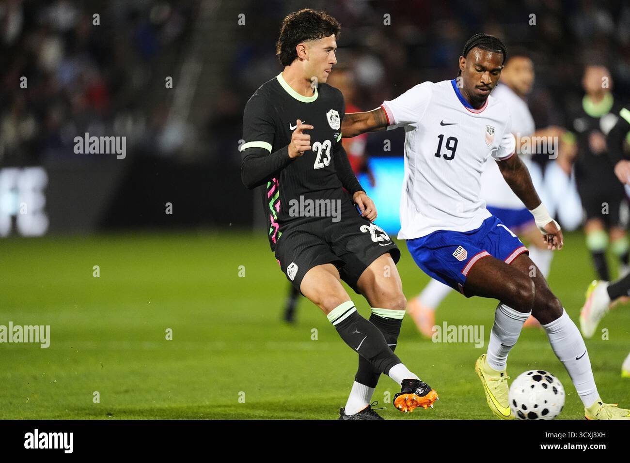Australia defender Alessandro Circati, left, passes the ball as United ...