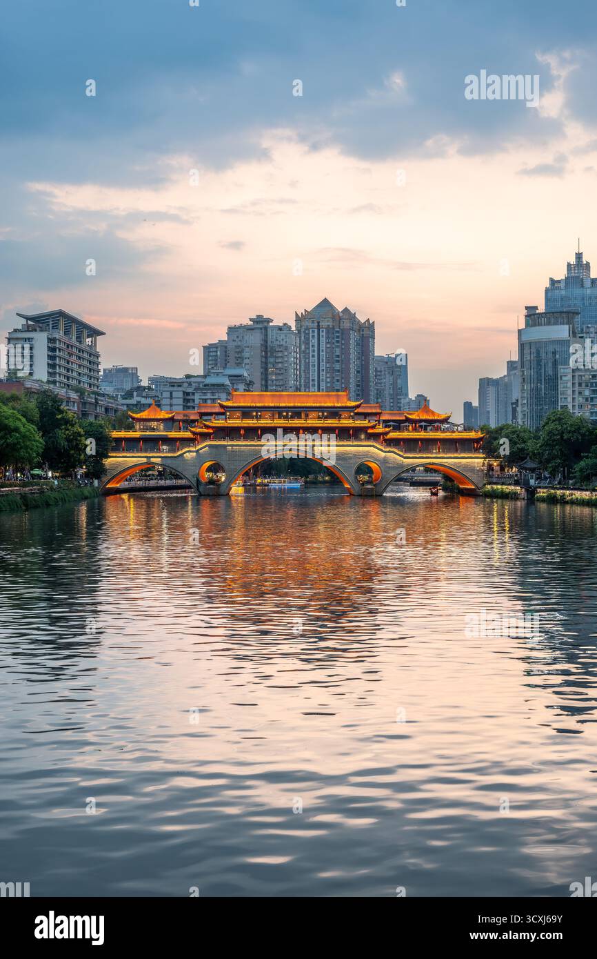 Dusk descends on Chengdu as the Anshun bridge glows warmly above the ...