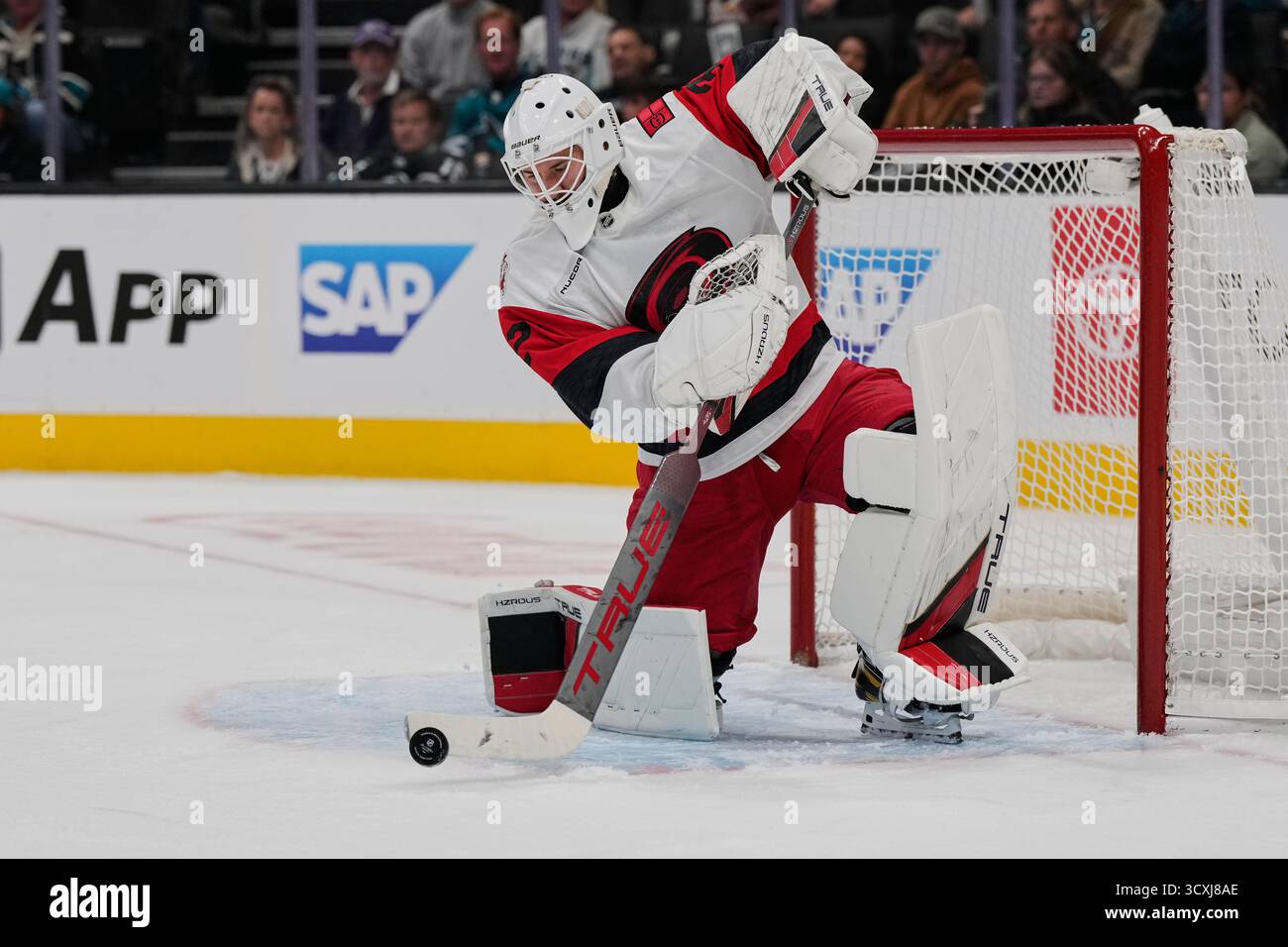 Carolina Hurricanes goaltender Brandon Bussi passes the puck during the ...