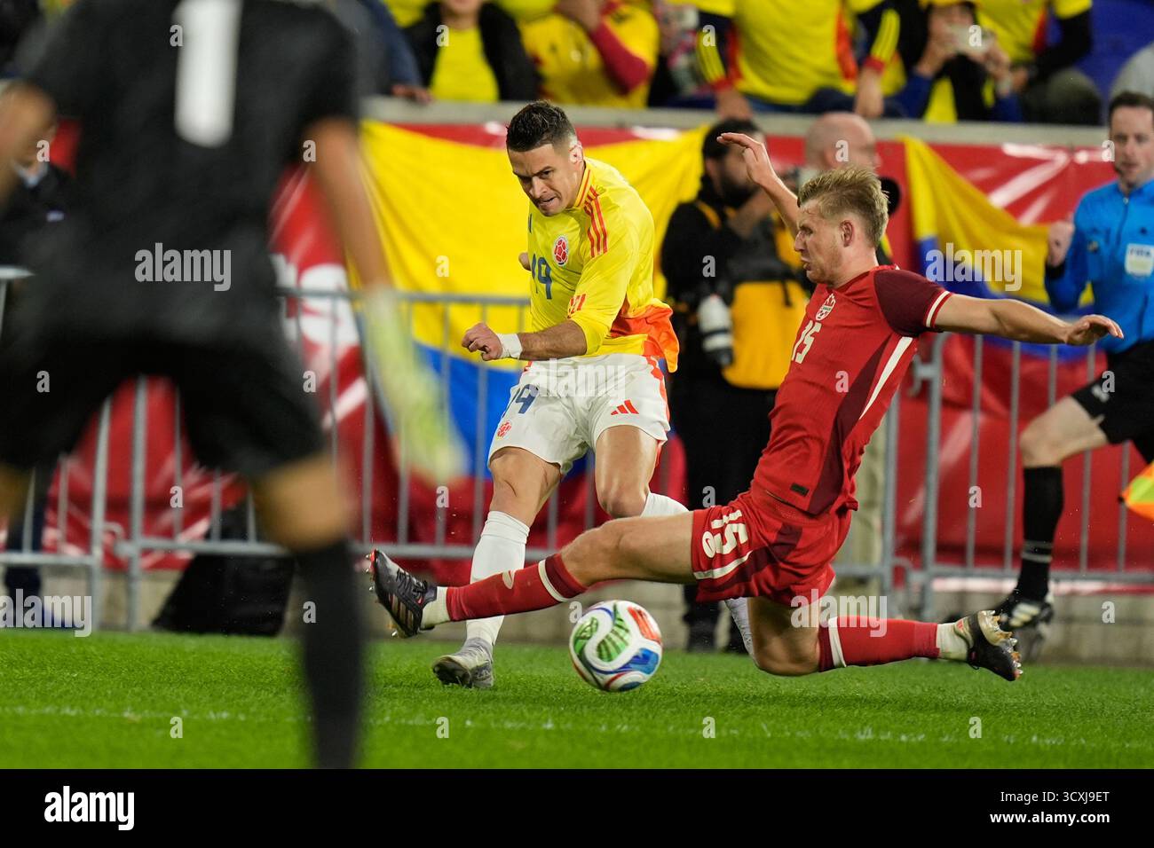 Colombia's Rafael Borre Santos, left, tries to take a shot past Canada ...