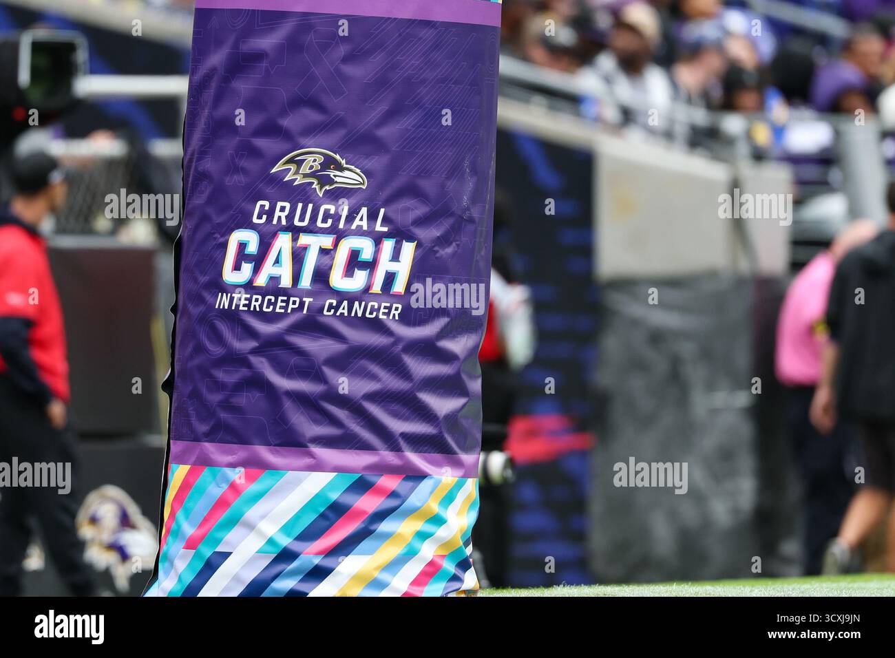 A Crucial Catch Cancer awareness banner sits on the goal post during an ...