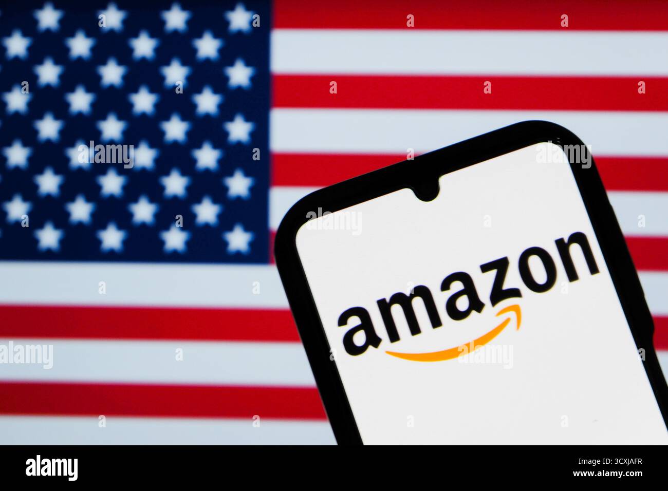 In this photo illustration, an Amazon logo is displayed on a smartphone ...