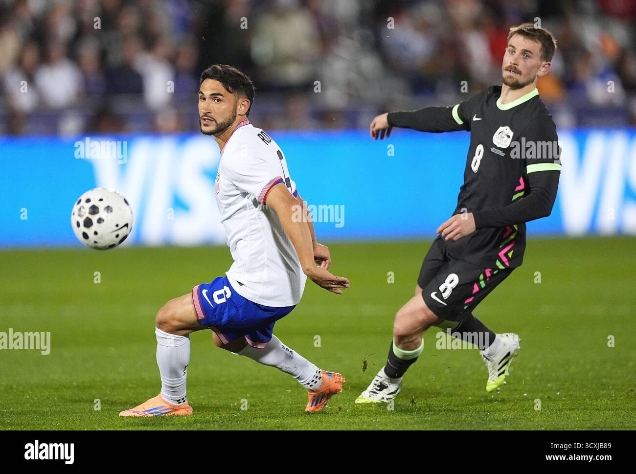 United States midfielder Christian Roldan, left, pursues the ball with ...