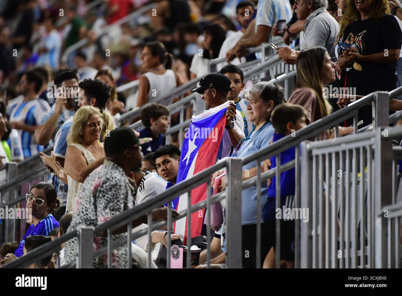 A fan holds up a Puerto Rican flag prior to the International Friendly ...