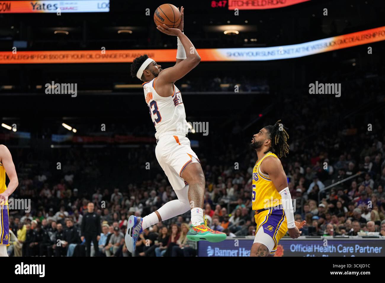 Phoenix Suns guard Jordan Goodwin (23) shoots over Los Angeles Lakers ...