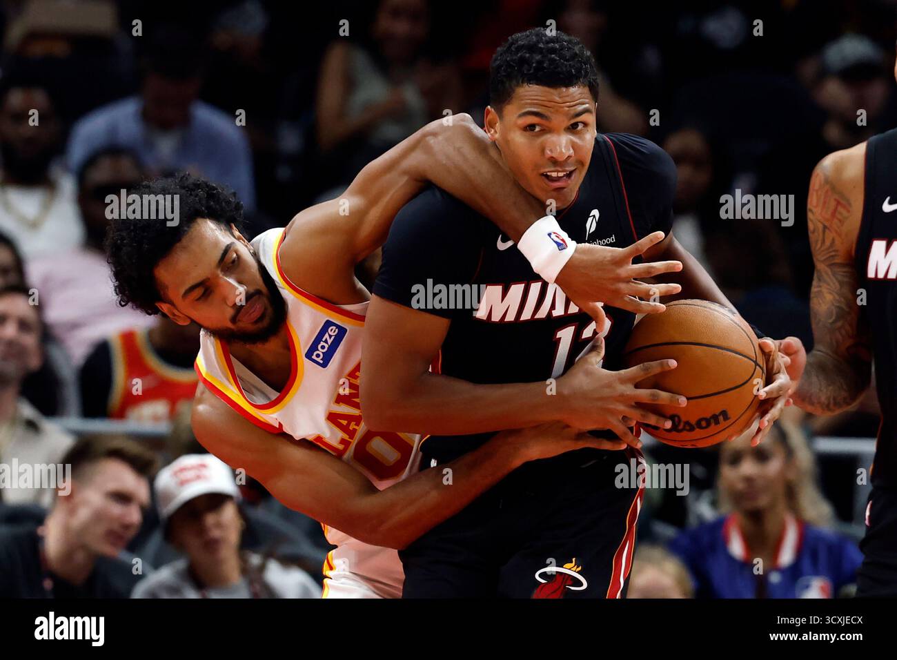 Atlanta Hawks forward Jacob Toppin (0) tries to steal the ball from ...