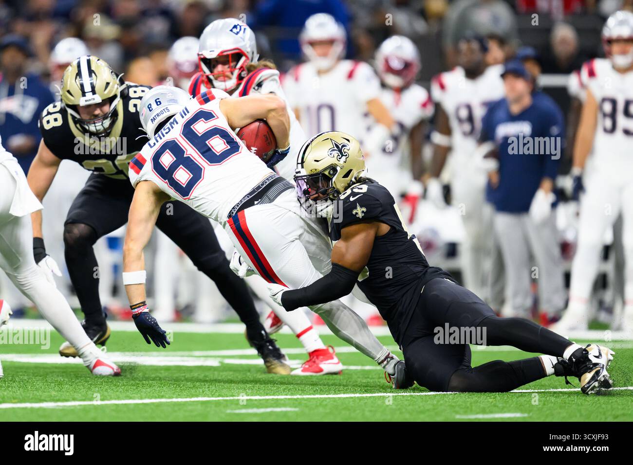 Efton Chism III #86 of the New England Patriots tackled by Jaylan Ford ...
