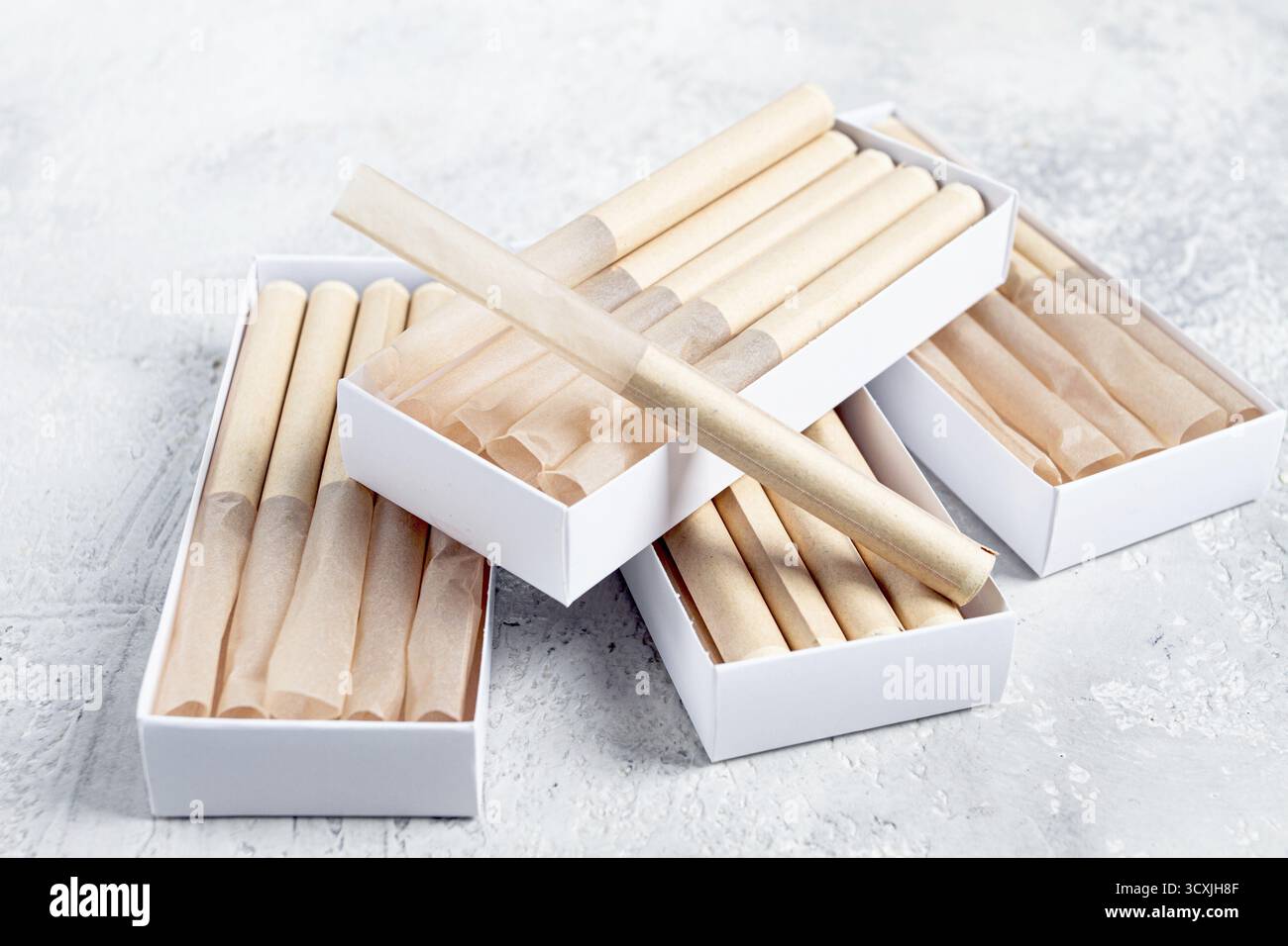 Cigarette casings, packed in boxes, on the table, top view Stock Photo ...