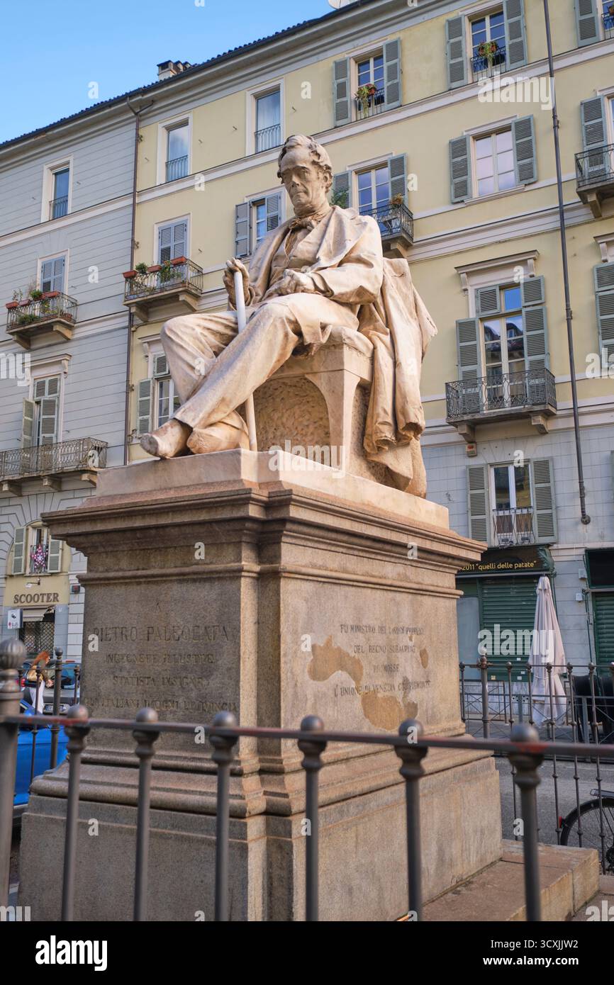A marble sculpture, statue of a sitting Pietro Paleocapa, a scientist ...