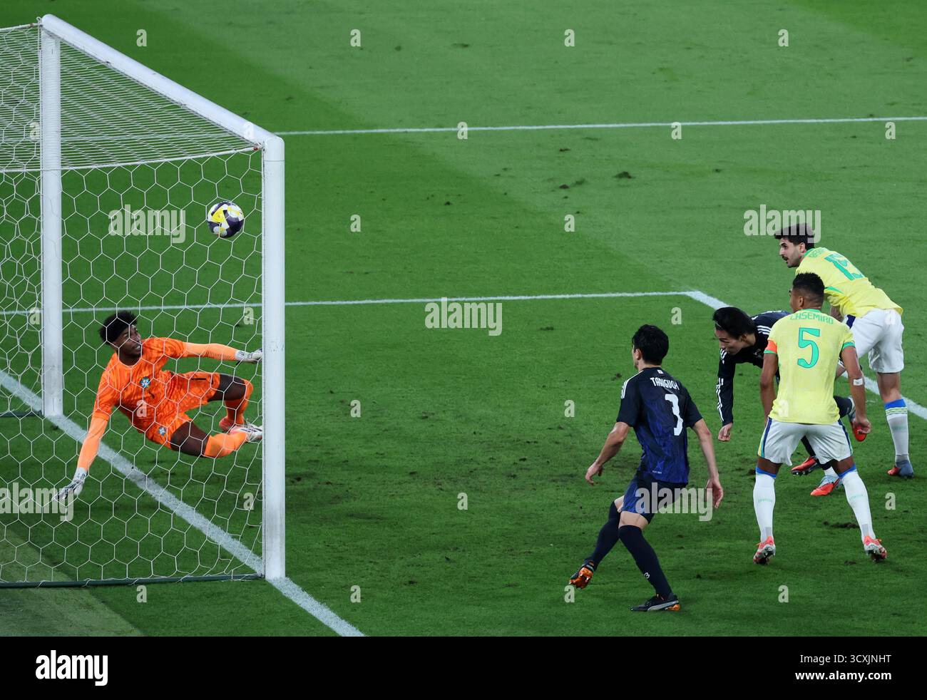 Ayase Ueda of Japan (3rd from R) scores by header in the second half of ...