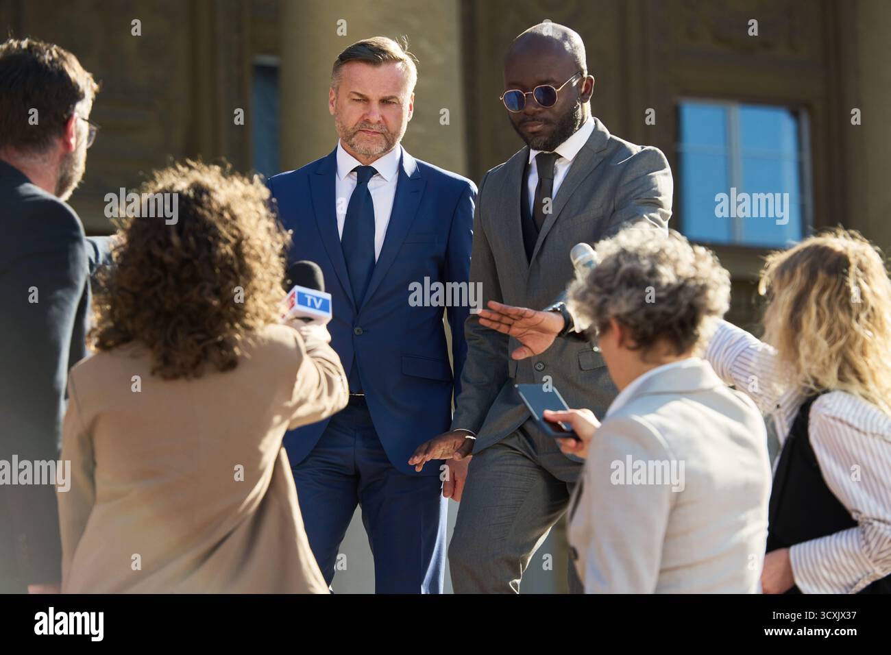 Standing microphone communication authority crowd hi-res stock ...
