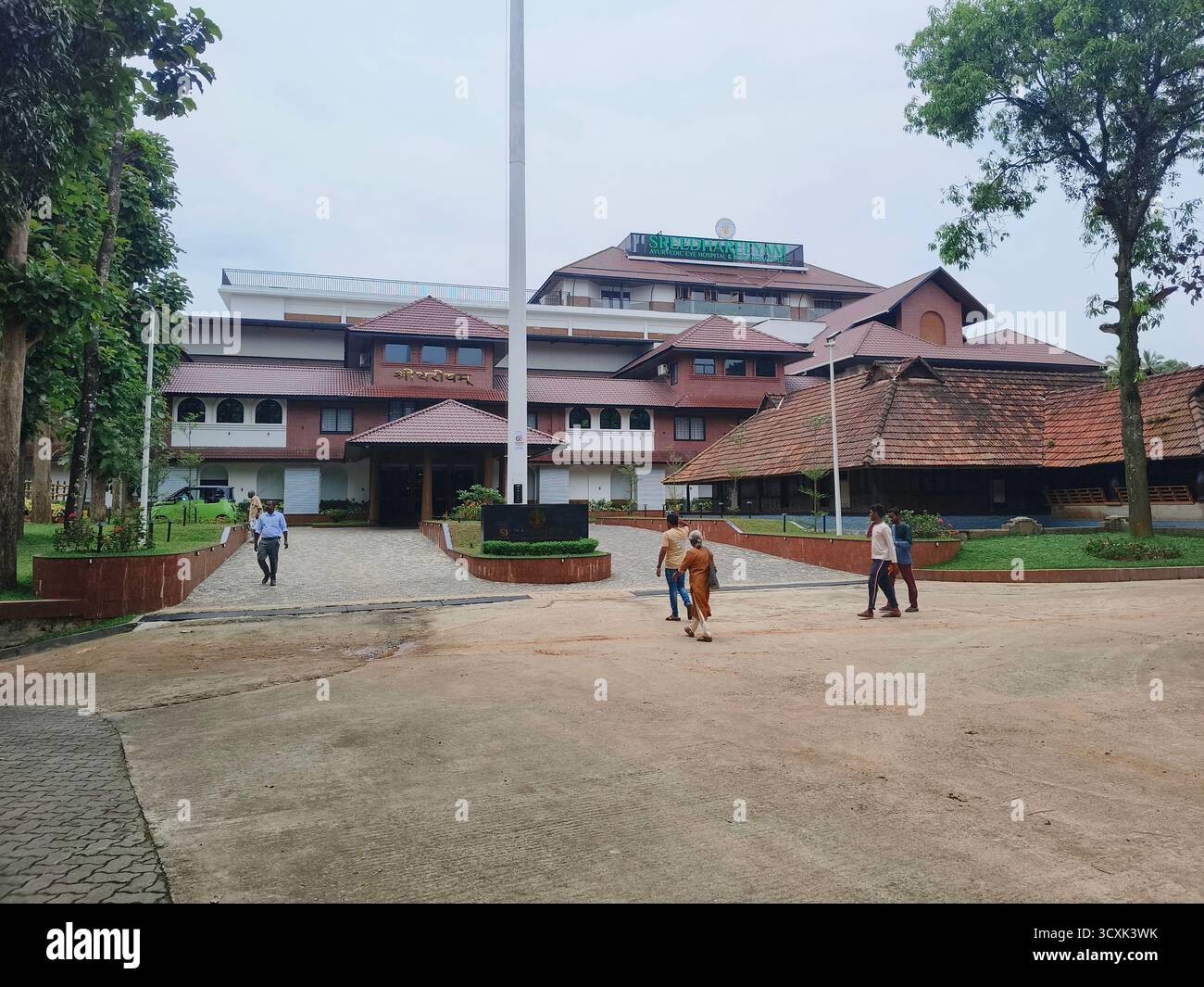 People walk outside the Sreedhareeyam Ayurvedic hospital in ...
