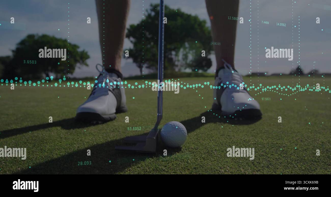 Aligning golfer lower legs on putting green, with golf putter behind ...