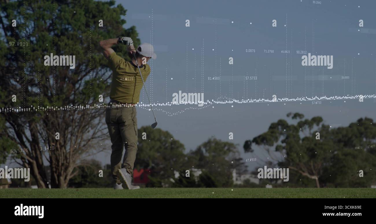 Swinging mature golfer finishing swing on fairway, with golf club, golf ...