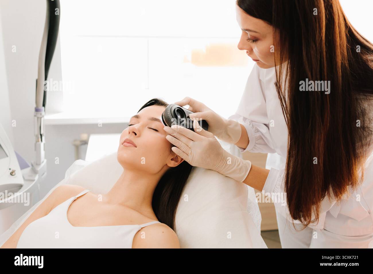 Dermatologist examines girl face hi-res stock photography and images ...