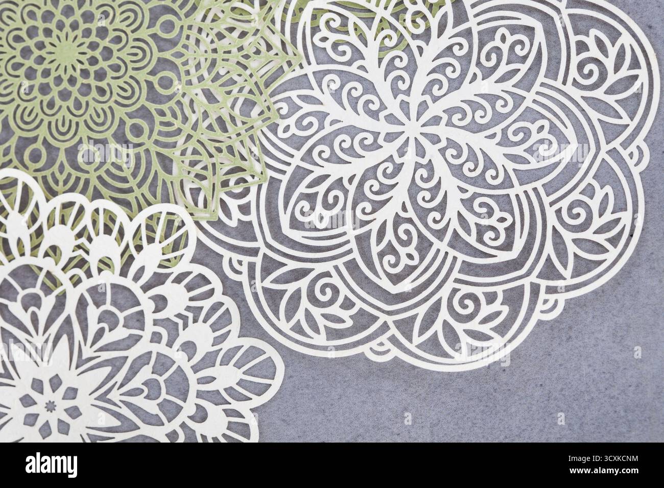 Lace doilies with very detailed designs on a grunge grey background ...