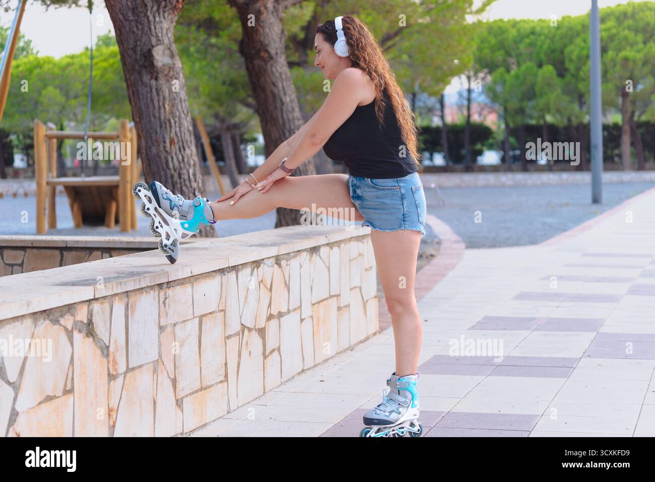 Woman stretching inline skates hi-res stock photography and images - Alamy