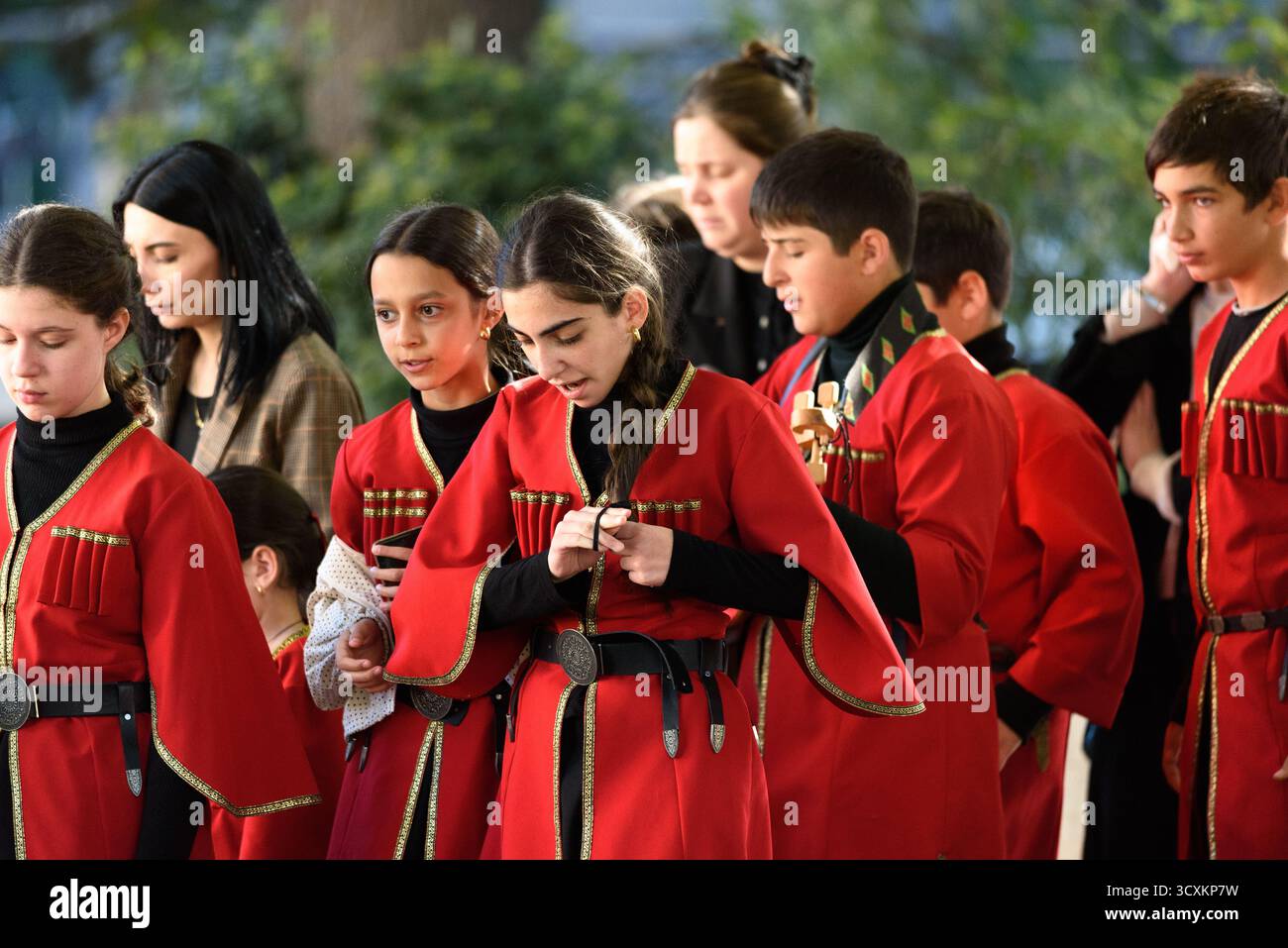 A group of children dressed in traditional Georgian folk costumes at a ...