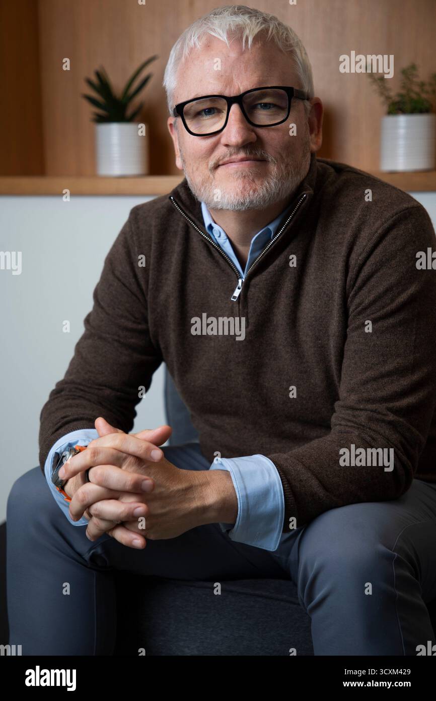 Ares Management partner Joel Holsinger poses for a portrait at his ...