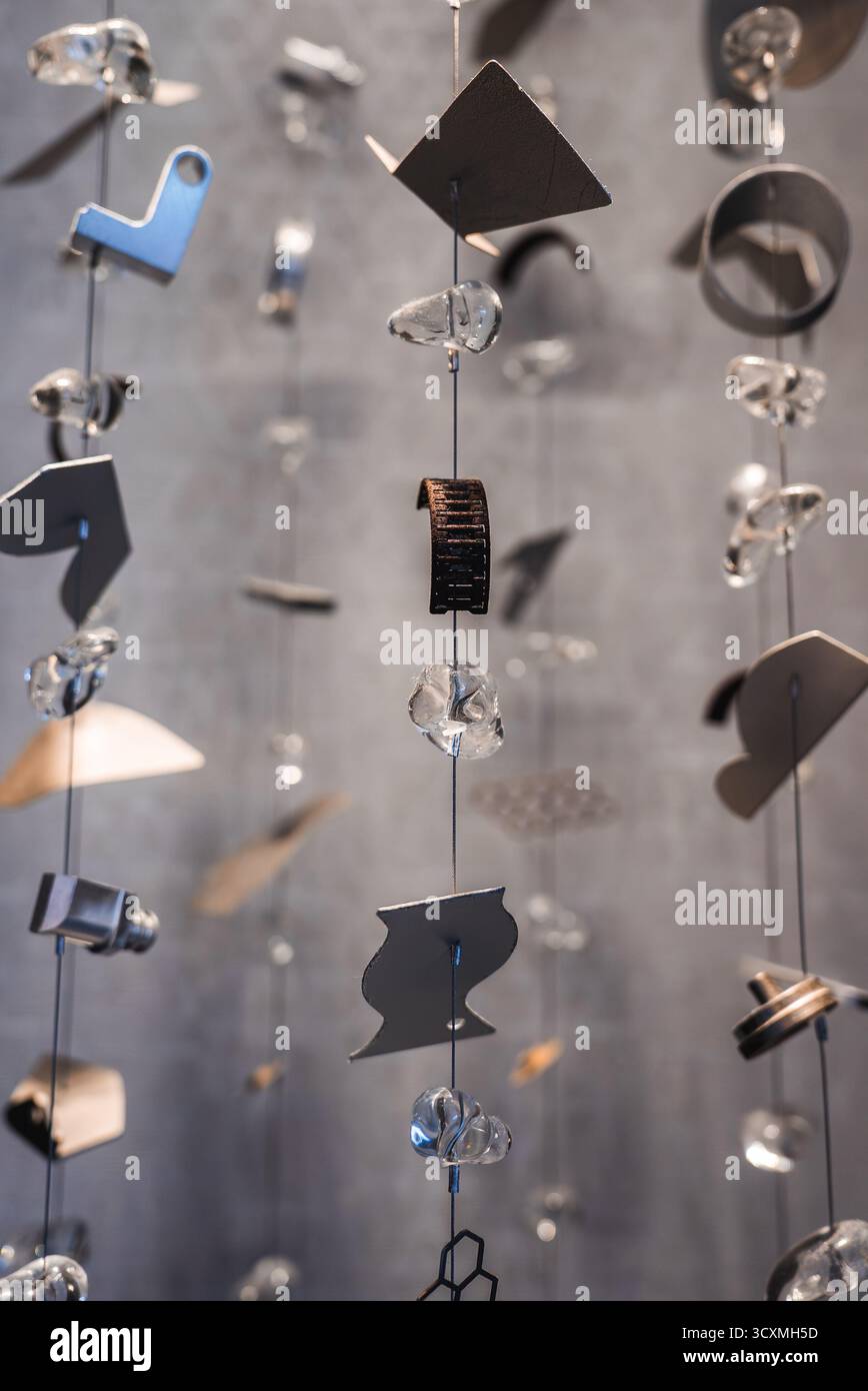 Close up of suspended mixed material art strands in Japan interior ...