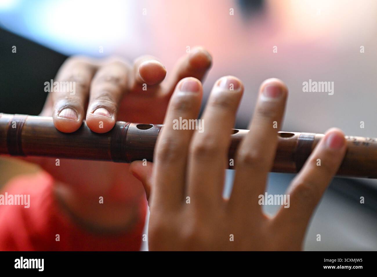 (251015) -- LHASA, Oct. 15, 2025 (Xinhua) -- Tawa Tsering plays flute ...