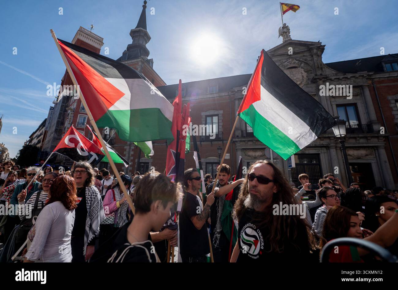 Demonstrators carry Palestinian flags during the rally for Palestine ...