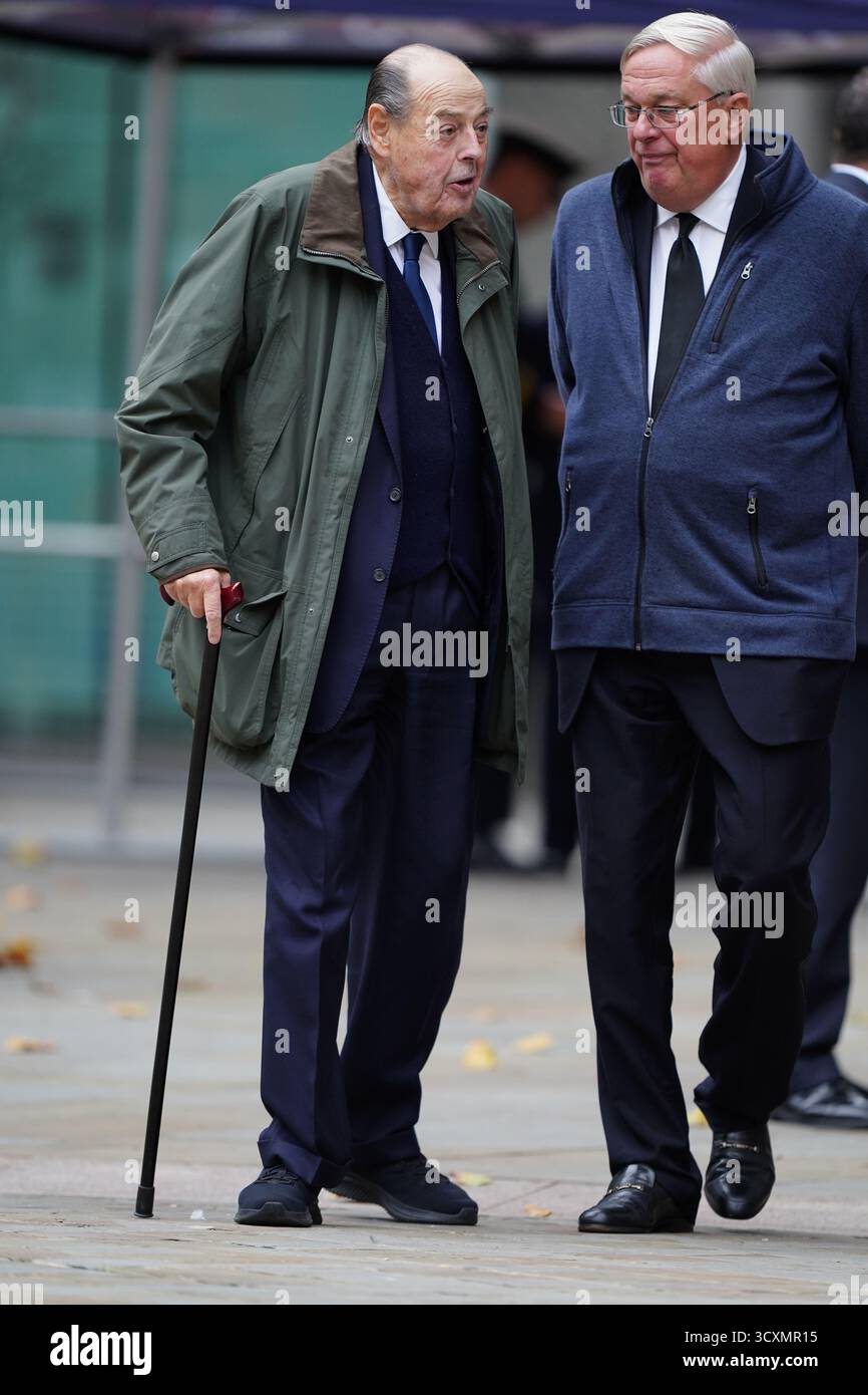 Lord Nicholas Soames of Fletching (left) arrives for the requiem mass ...
