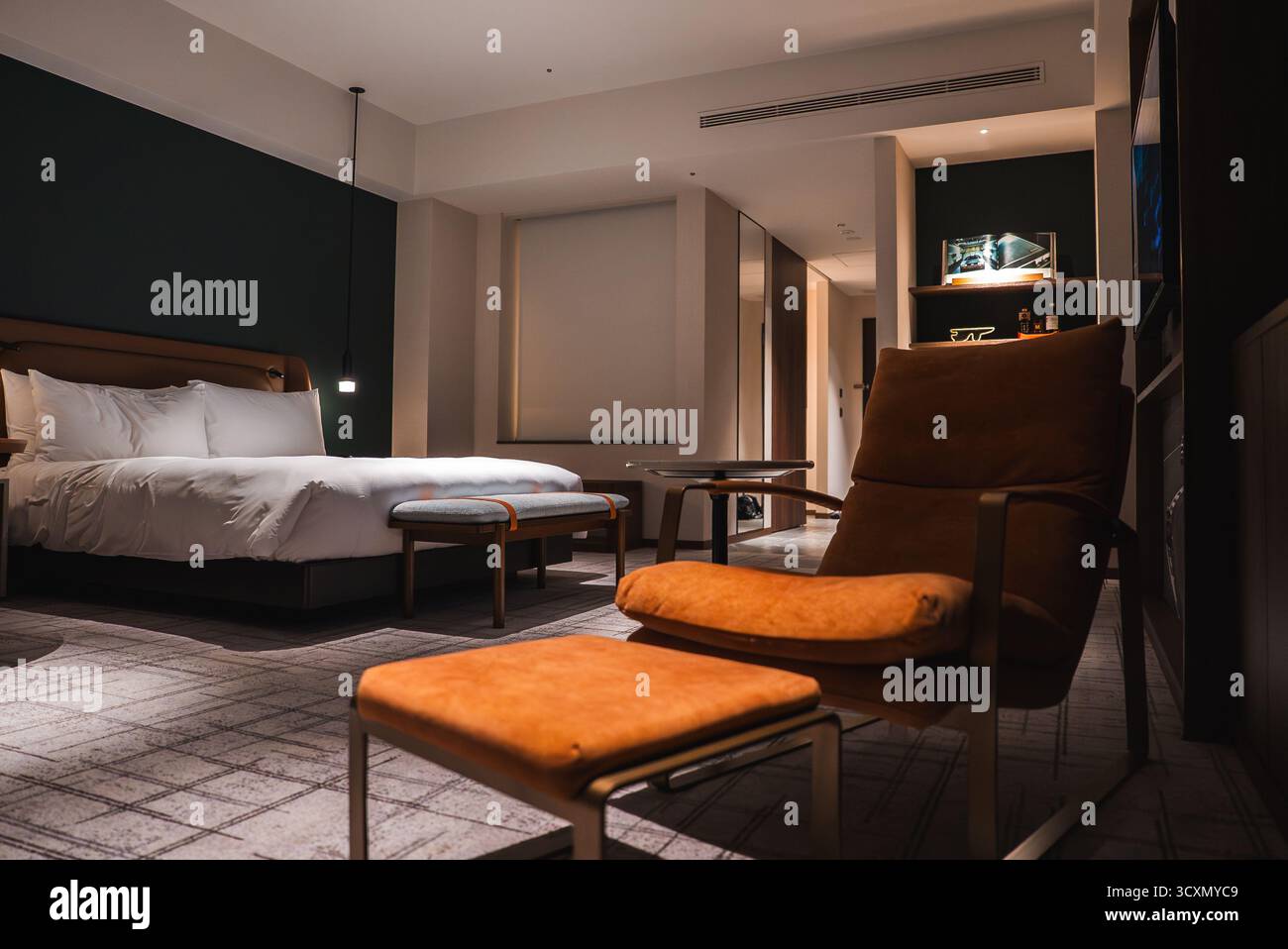 Warmly lit luxury hotel room with Japanese inspired modern design Stock ...