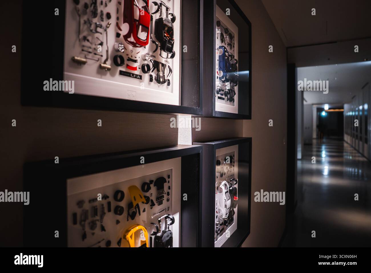 Curated corridor in Japan with shadow boxes of deconstructed model cars ...