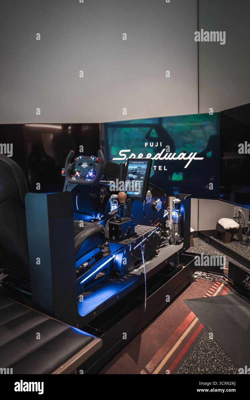 Racing simulator rig in Fuji Speedway Hotel lounge with blue lighting ...