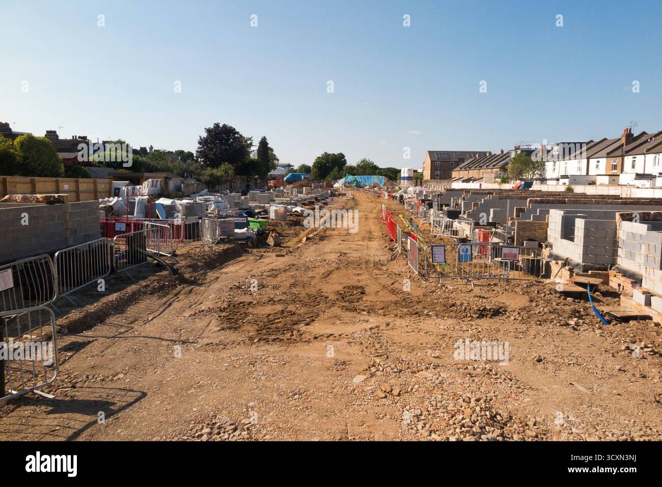 Construction site & exterior partly built town houses / housing block ...