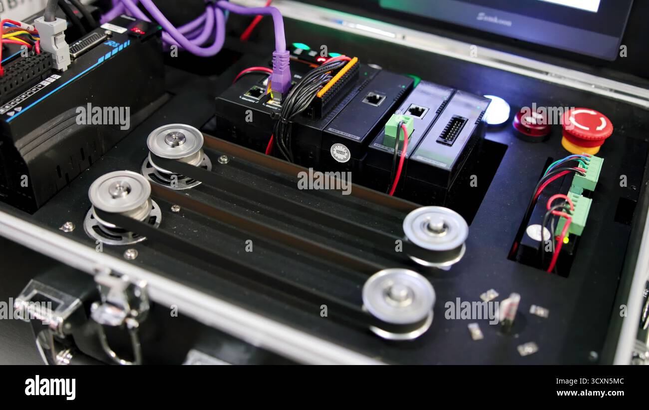 Electronic device with conveyor belt and screen changing colors. Media ...