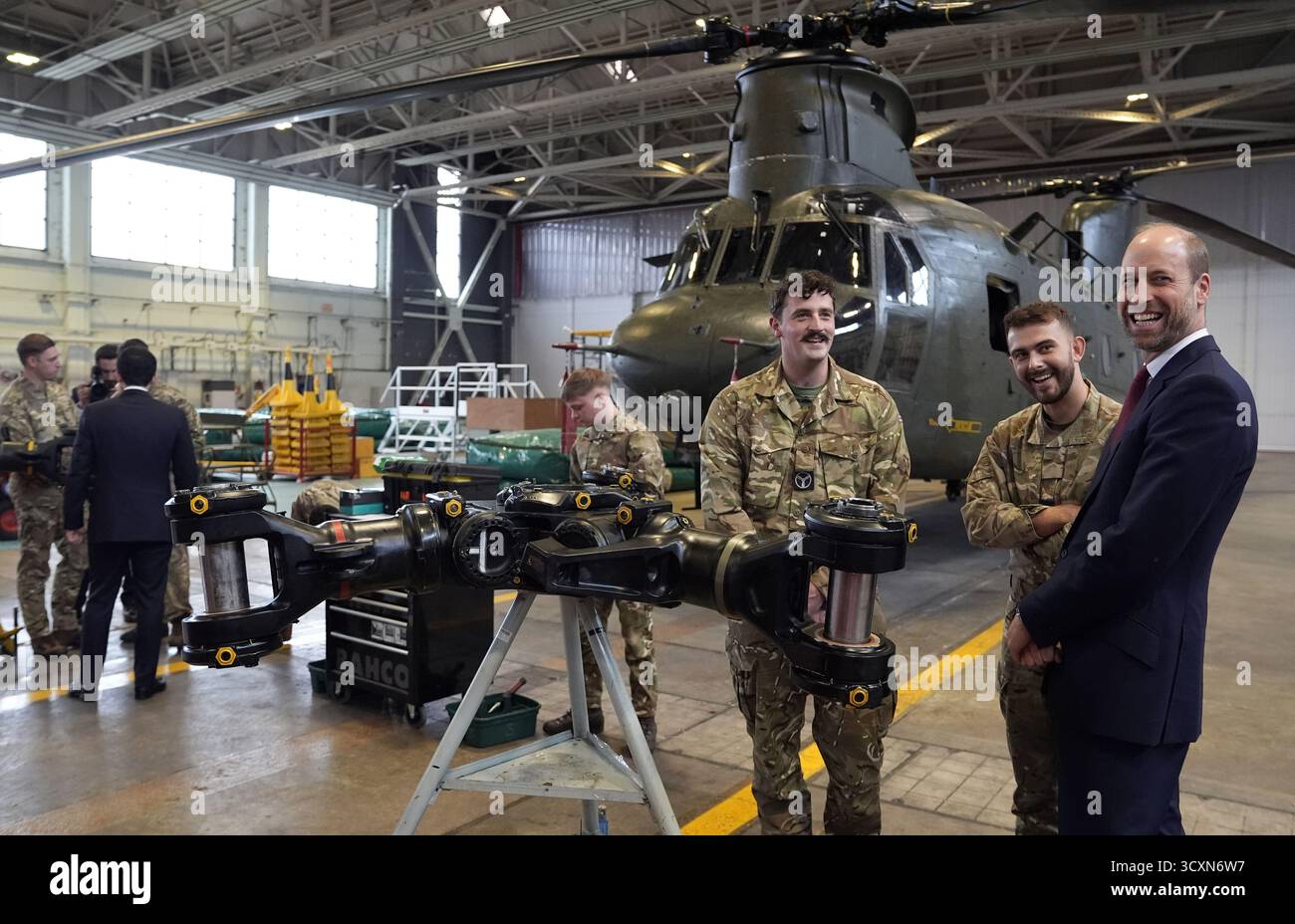 Britain's Prince William, right, meets maintenance crew from No. 28 (AC ...
