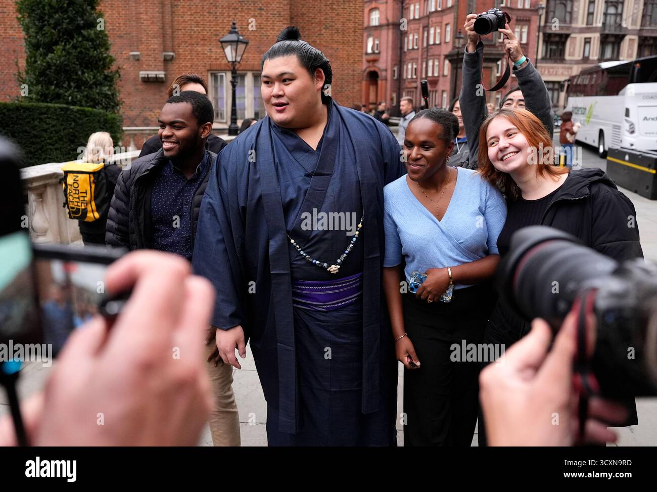 Yokozuna Onosato with fans ahead of day one of the Grand Sumo ...