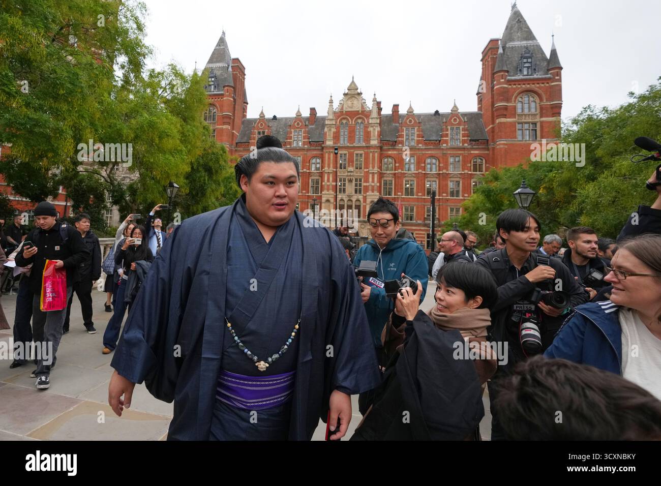 Sumo wrestler Onosato is surrounded by fans as he arrives to The Grand ...