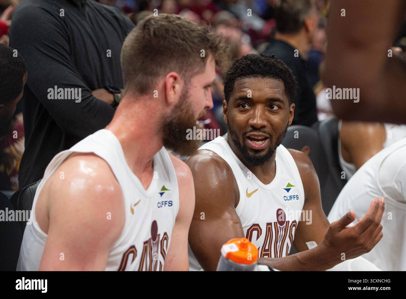 Cleveland Cavaliers' Donovan Mitchell, right, talks with Dean Wade ...