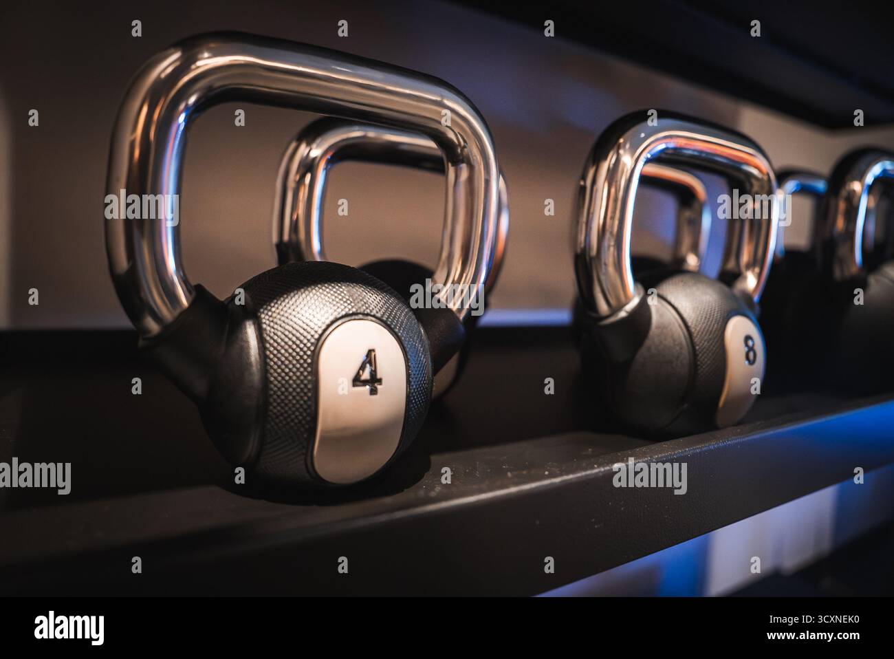 Modern kettlebells on rack hi-res stock photography and images - Alamy