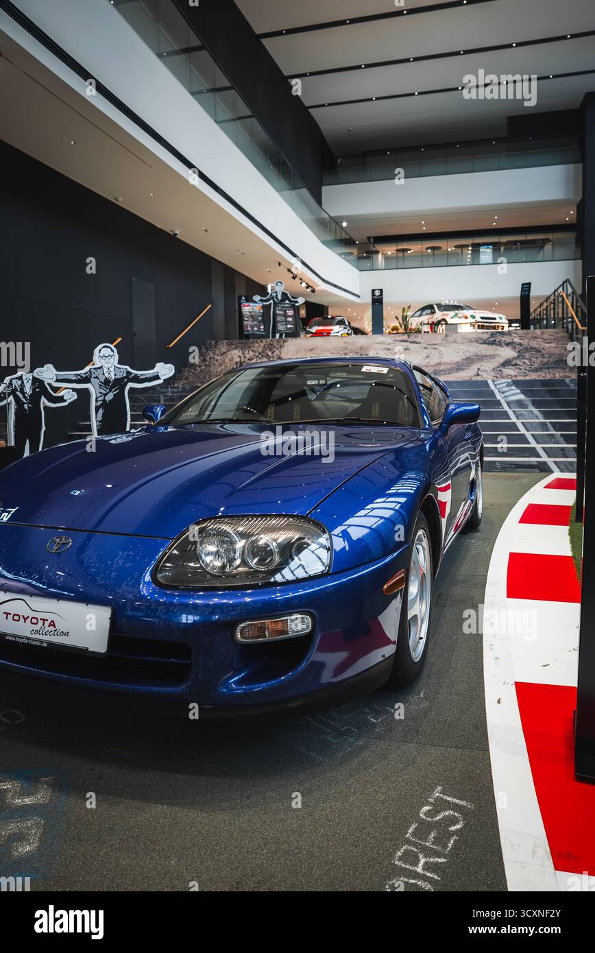 Blue Toyota Supra on mock racetrack corner at Toyota museum Japan Stock ...