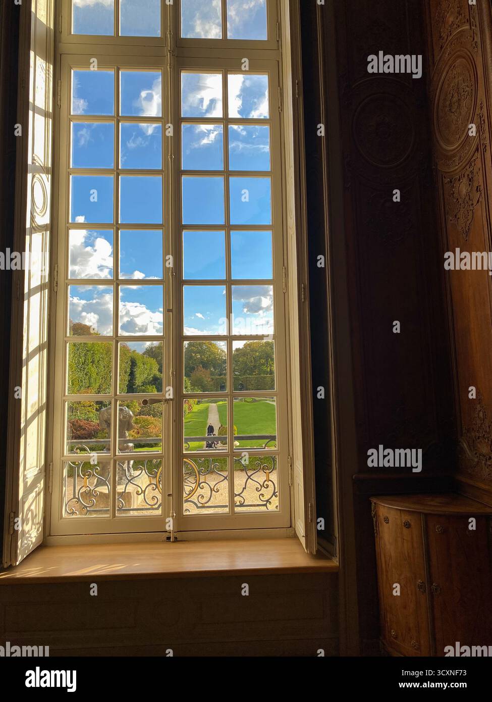 Scenic Garden View through Elegant Window Stock Photo - Alamy