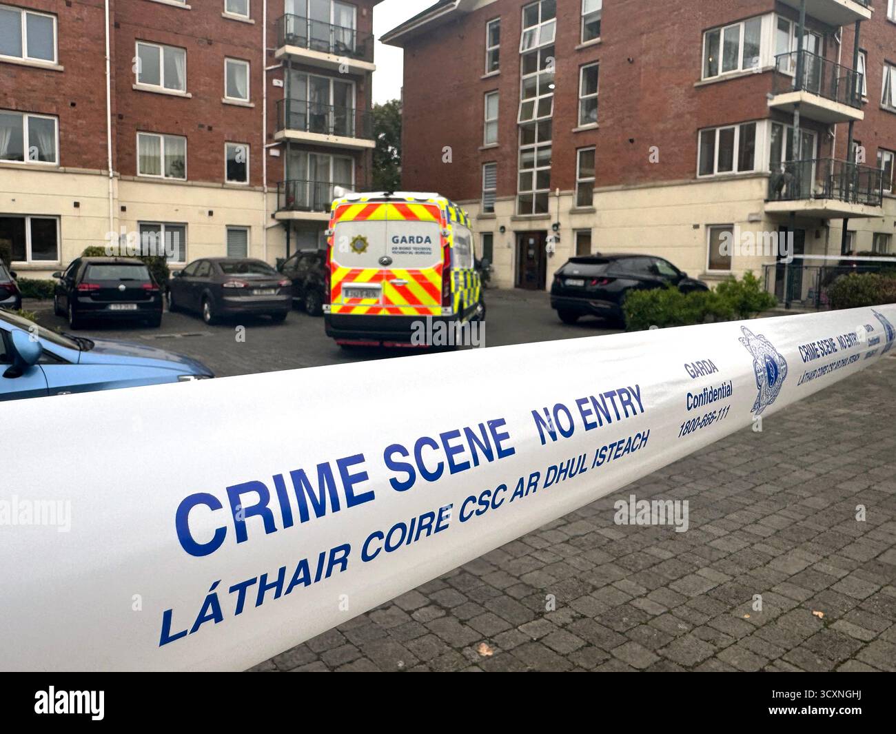 A vehicle from the Garda Technical Bureau is visible behind a crime ...