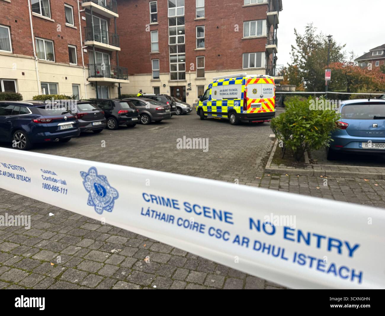 A vehicle from the Garda Technical Bureau is visible behind a crime ...