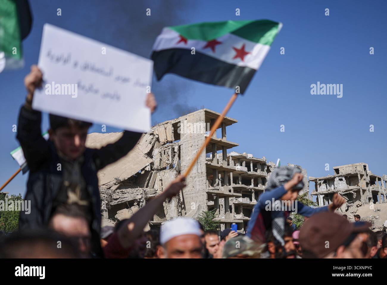 War-damaged residential buildings loom as residents of Damascus' Jobar ...