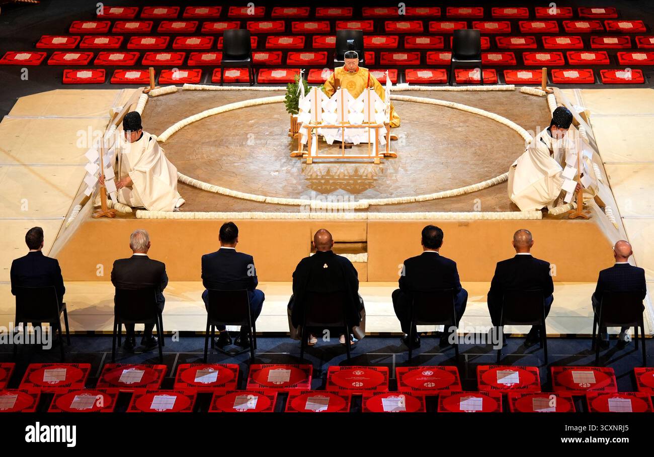 Gyoji perform the blessing of the sumo ring on day one of the Grand ...