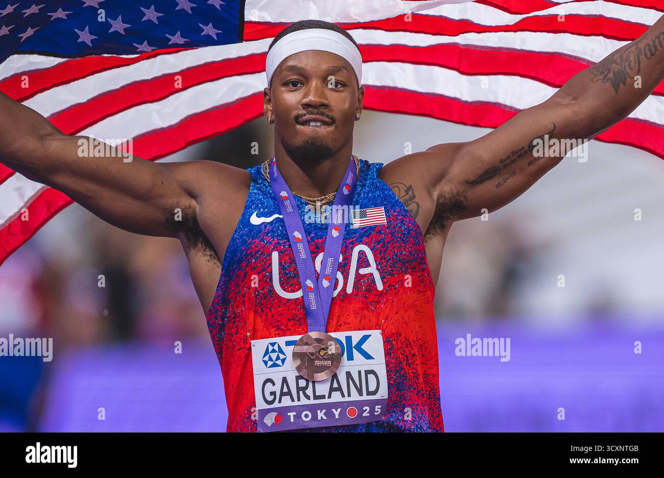 Kyle Garland celebrating her victory with her country's flag at the ...