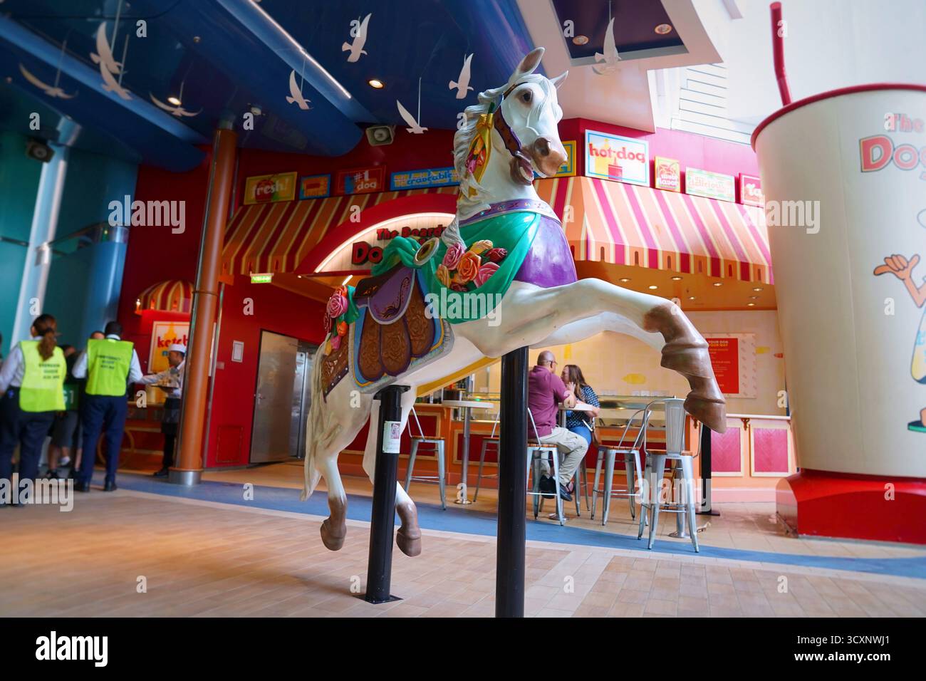 A completed carousel horse stands near the Boardwalk Dog House aboard ...