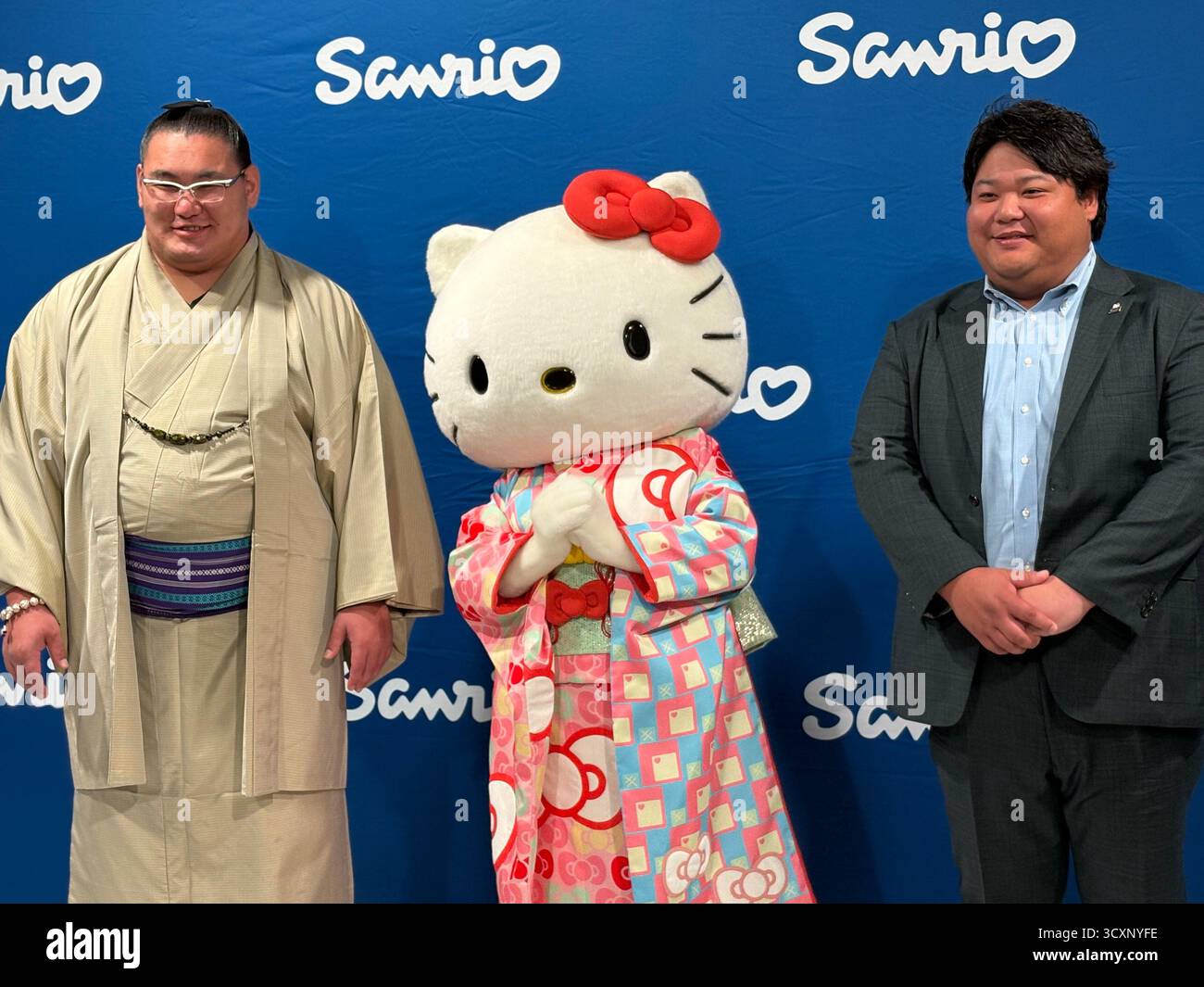 Hello Kitty, sumo wrestler Hoshoryu Tomokatsu and the CEO of Sanrio ...