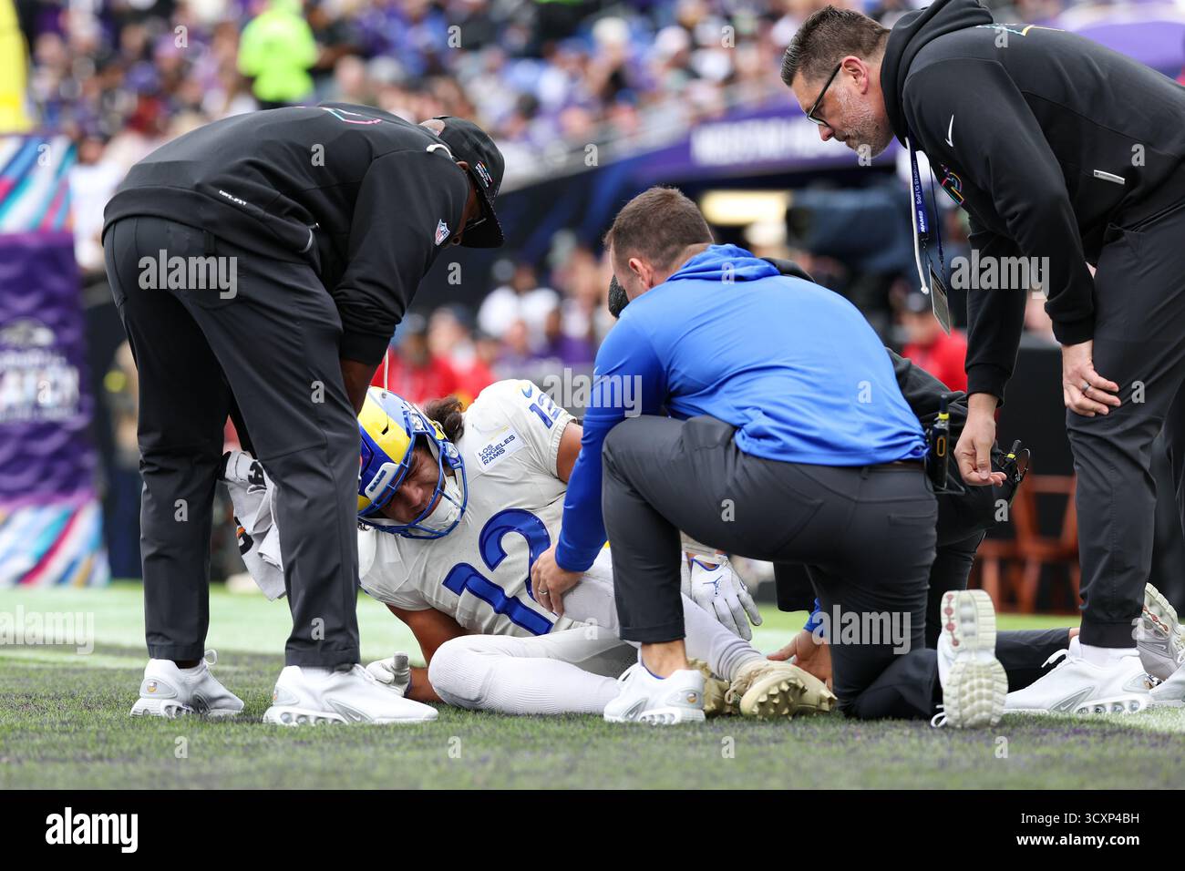 Los Angeles Rams wide receiver Puka Nacua (12) is seen by trainers ...
