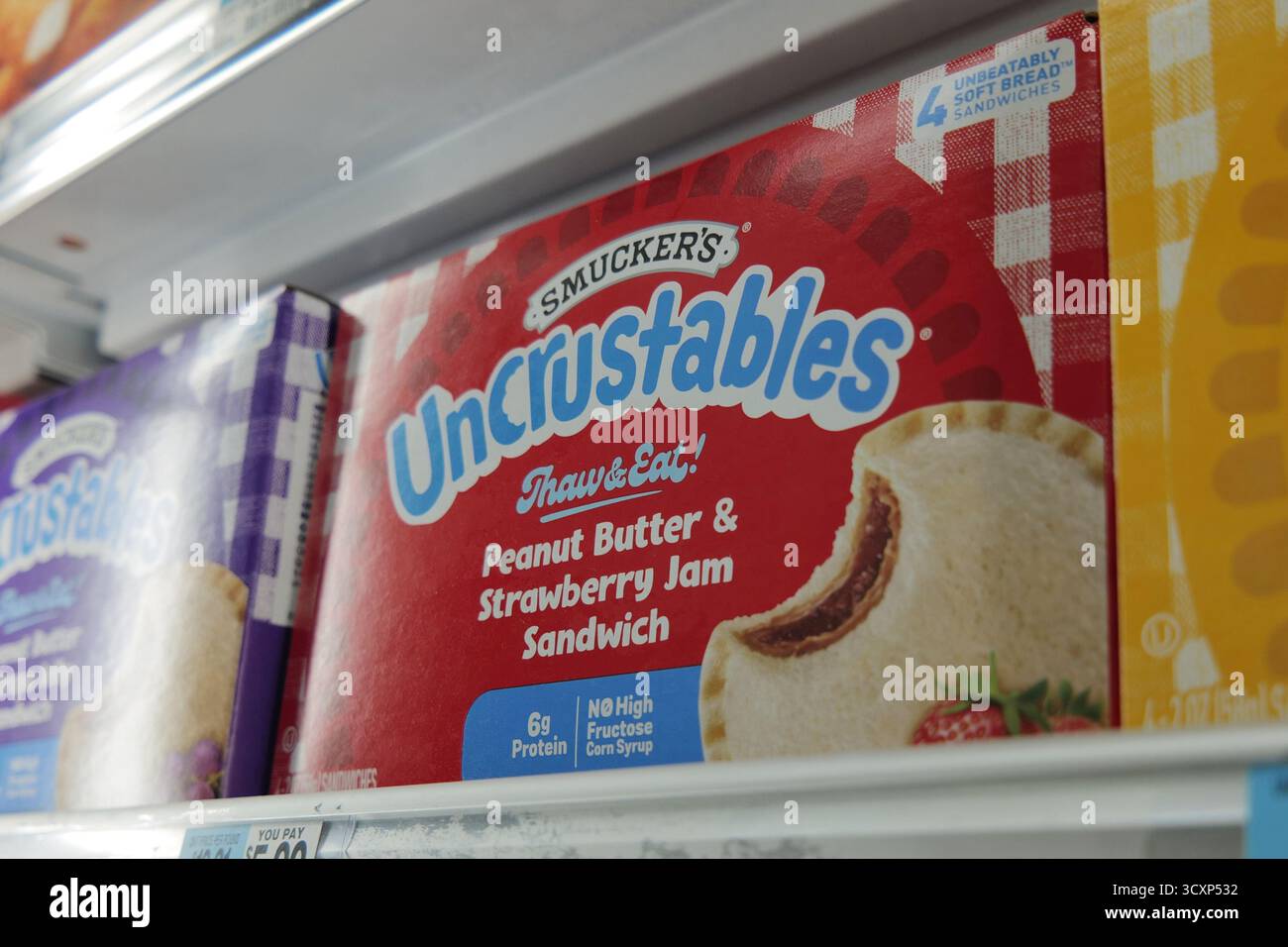 A box of Smucker's Uncrustables sandwiches are seen in a freezer of a ...